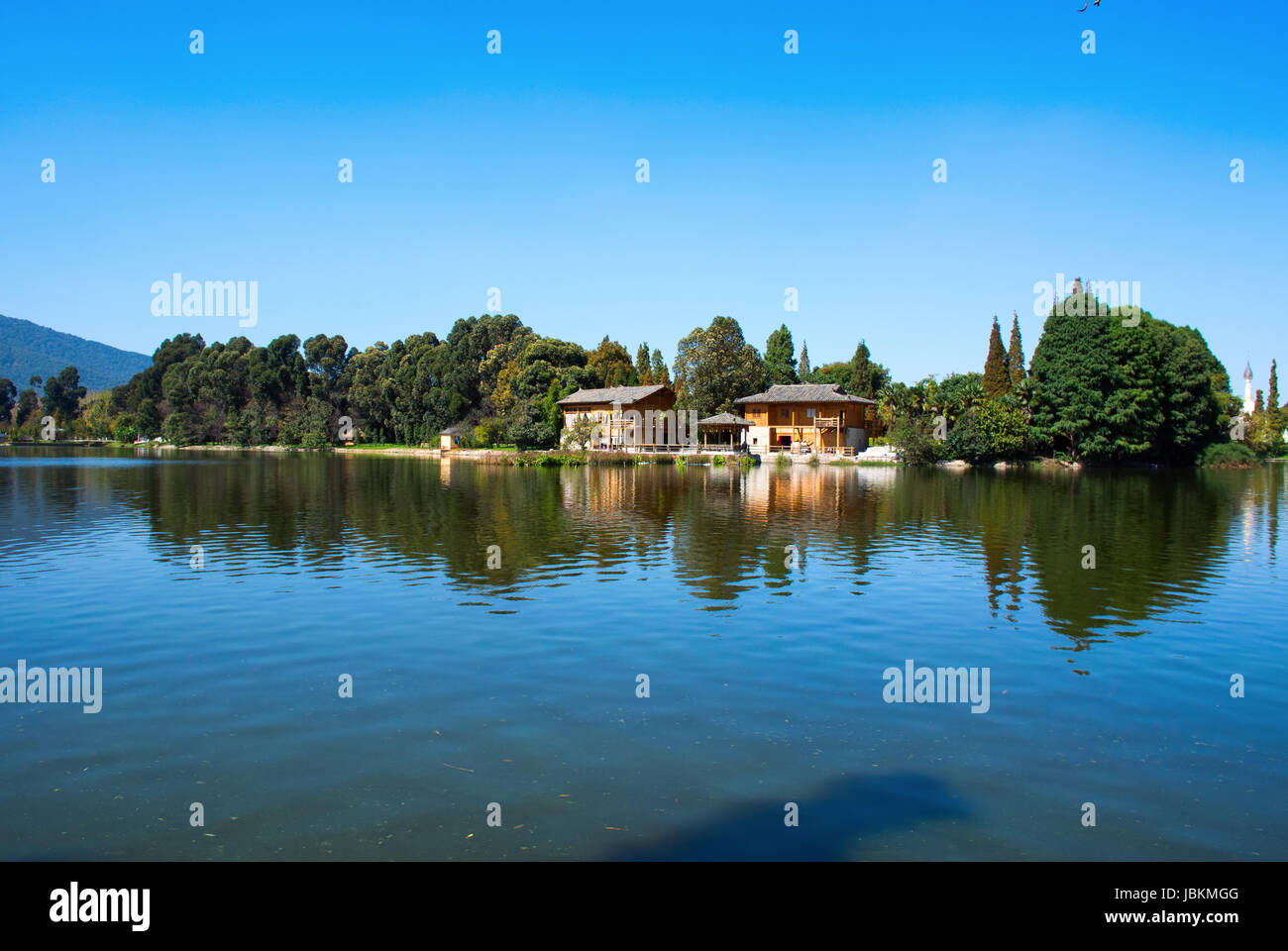 The reflection of forest, pagoda and hut Stock Photo - Alamy