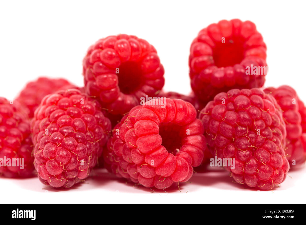 ripe red raspberry isolated on white background Stock Photo - Alamy