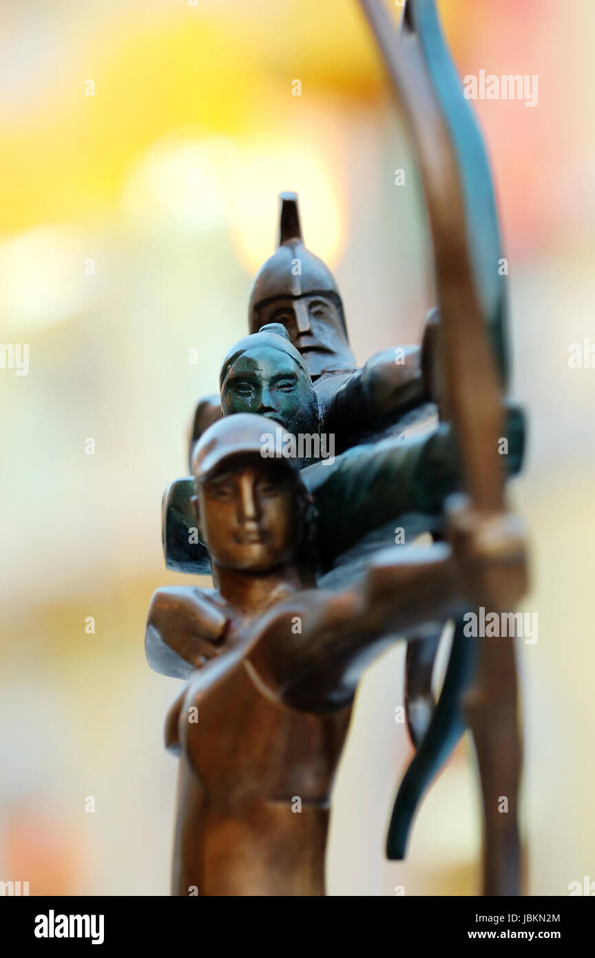The statues of athletes prepare for shooting arrows Stock Photo - Alamy