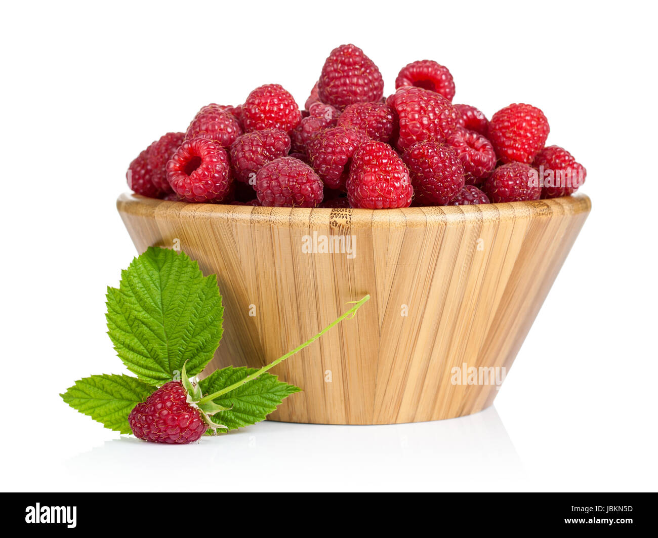 Fresh raspberries in wooden bowl on white background Stock Photo - Alamy