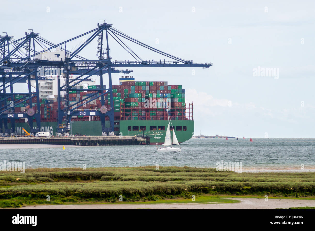 Yacht "Sun Odyssey" sails by Container ship CSCL JUPITER of China ...