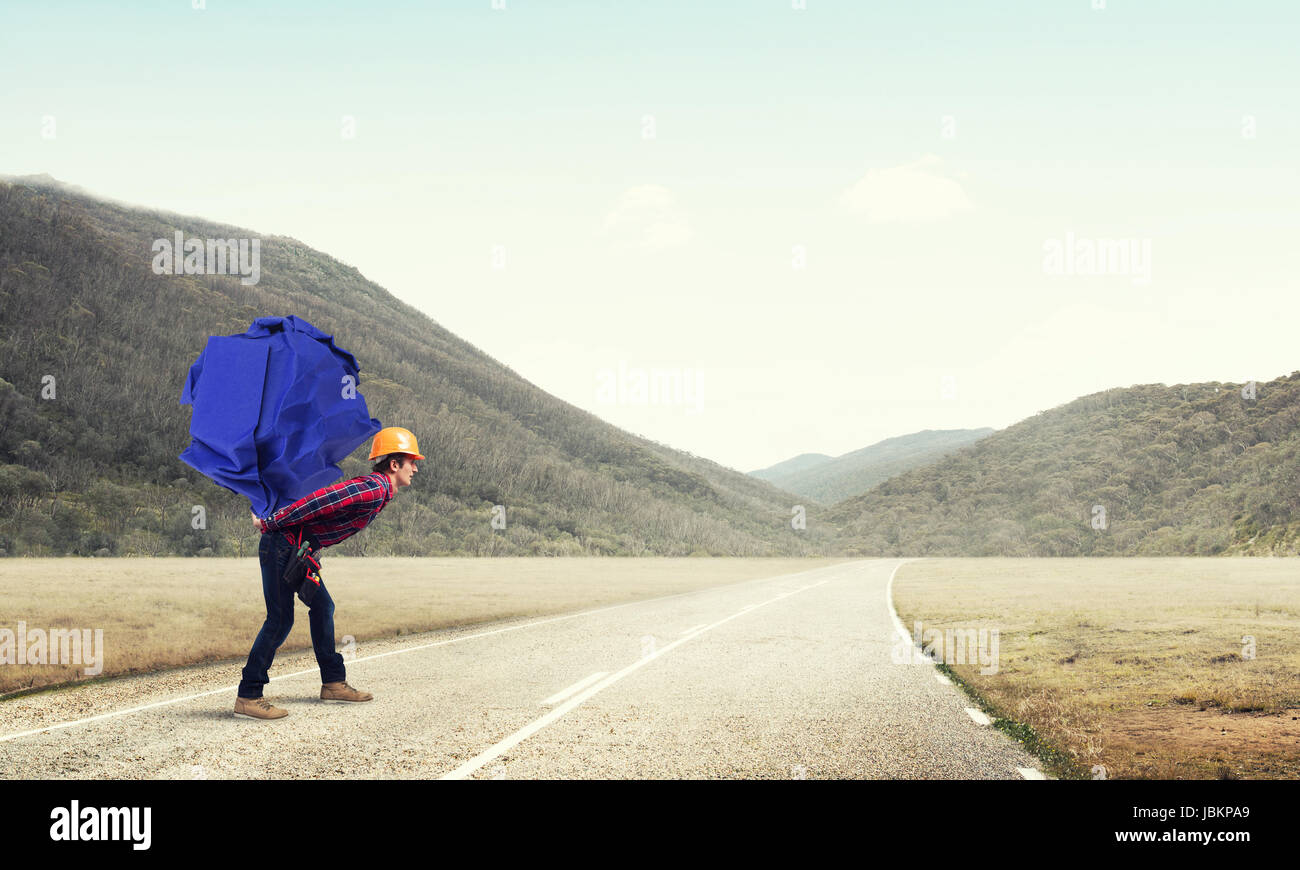 Engineer man carry load Stock Photo - Alamy