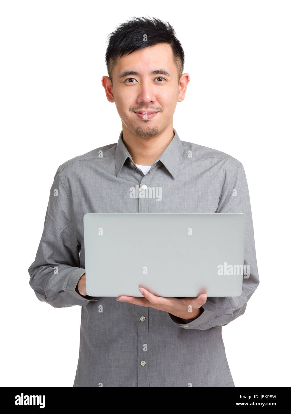 Young man holding laptop Stock Photo - Alamy