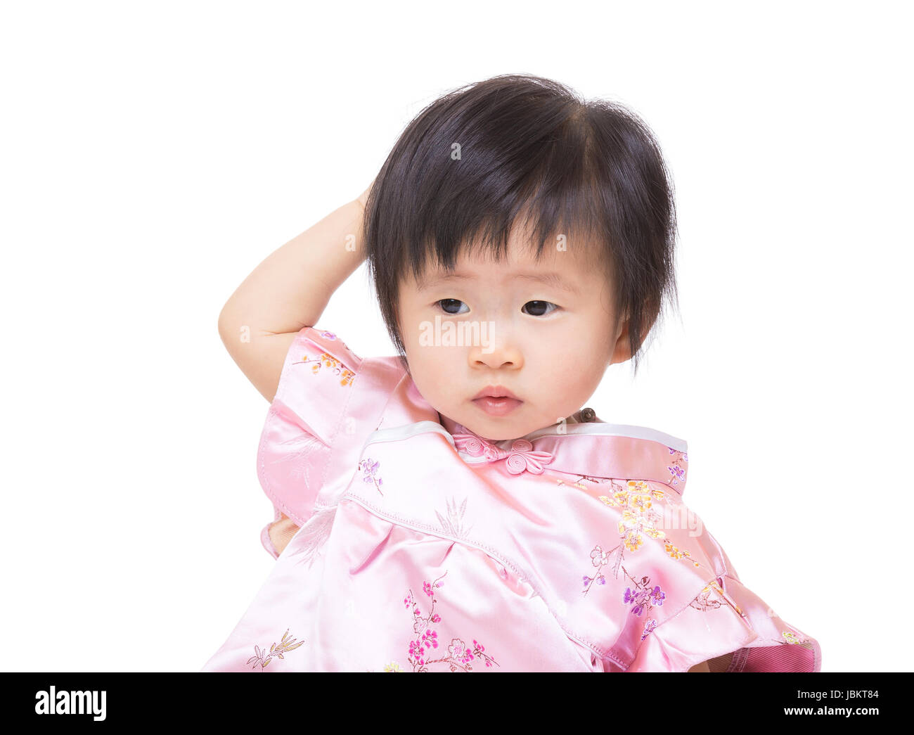 Chinese baby girl touching her head Stock Photo - Alamy