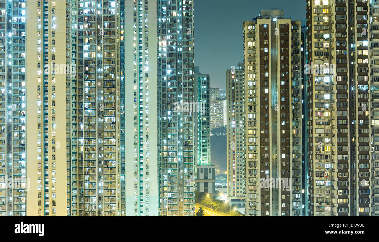 Packed building in Hong Kong at night Stock Photo - Alamy