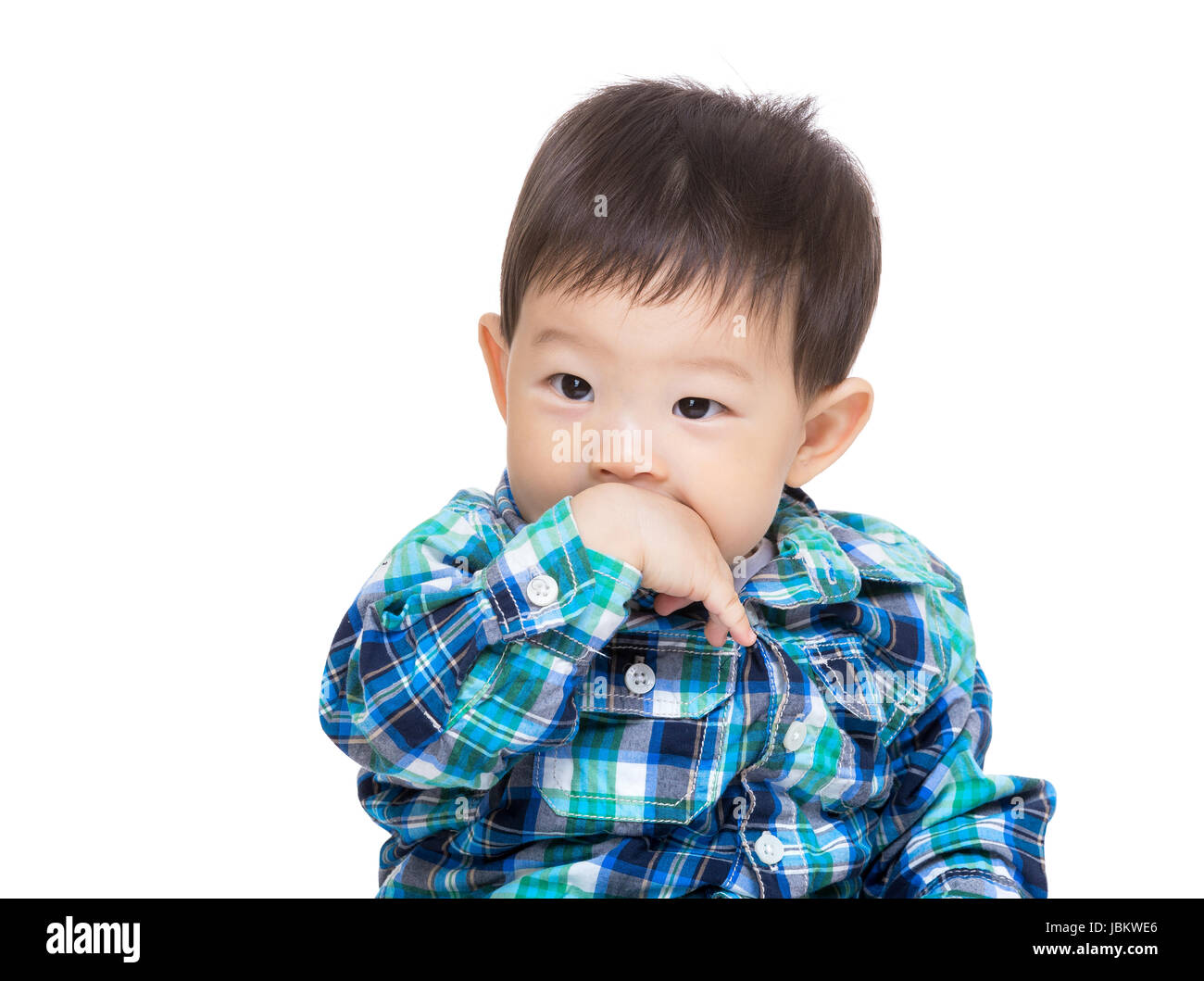 Asia baby boy bite his hand Stock Photo - Alamy