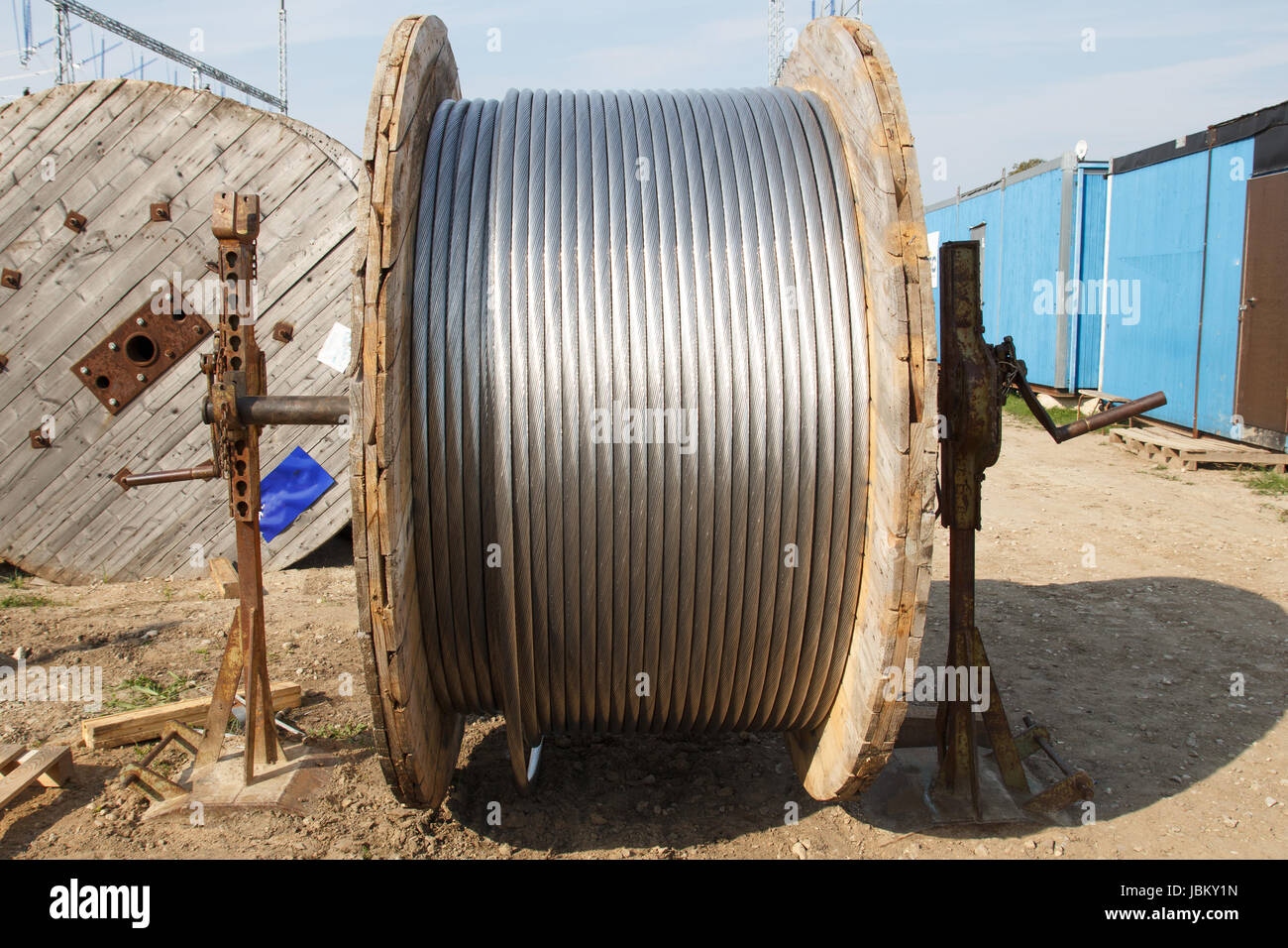large wooden bobbin with electrical wire Stock Photo - Alamy