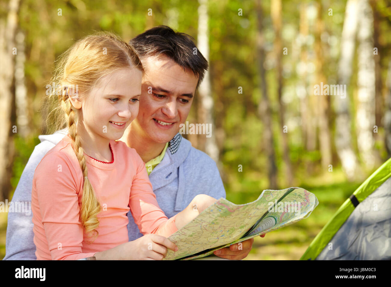 Portrait of father and his daughter looking at map while on trip Stock ...