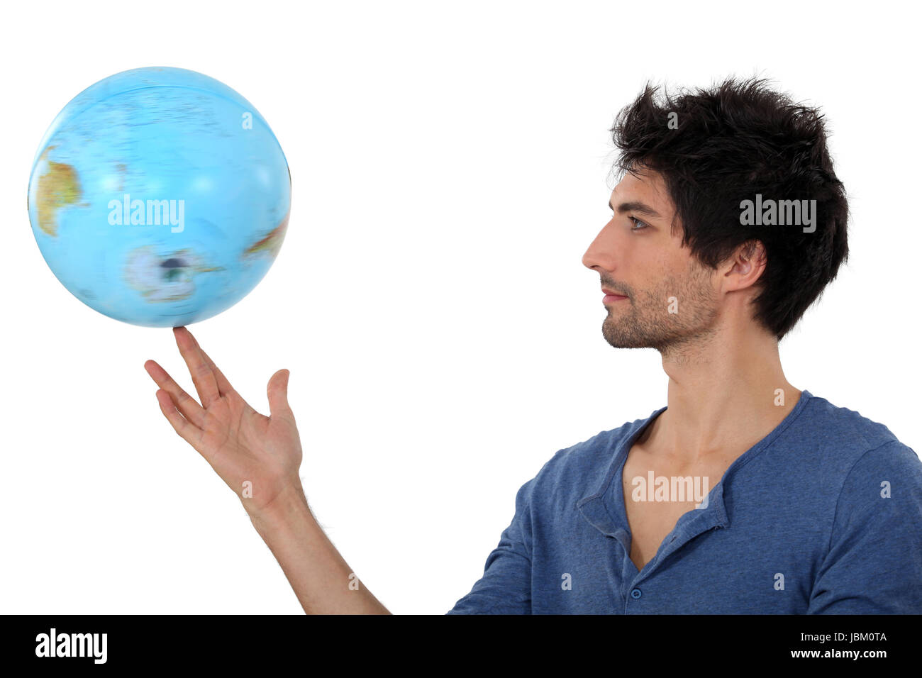 Man turning globe hi-res stock photography and images - Alamy