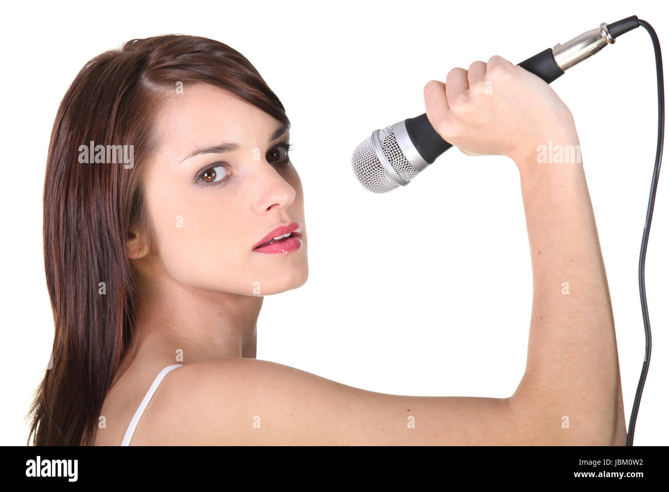 Girl singing with microphone Stock Photo - Alamy