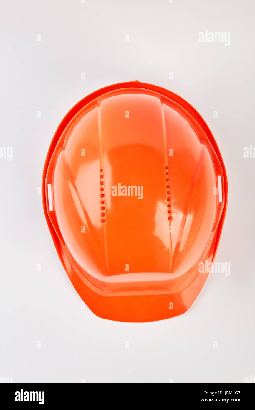 Orange safety helmet isolated Stock Photo - Alamy