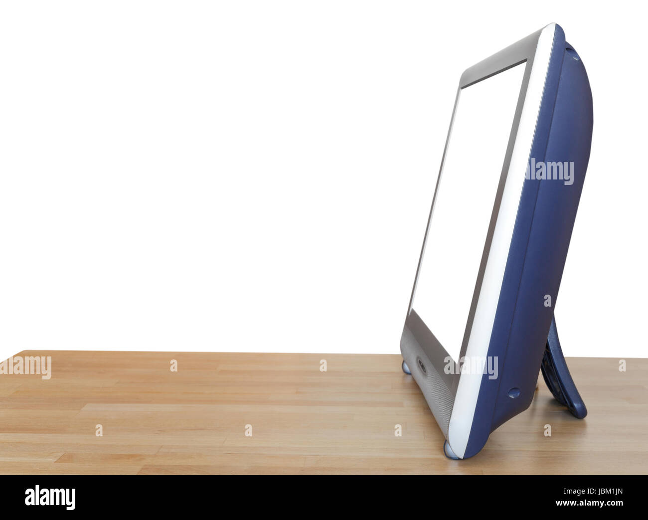 side view of TV set display with cutout screen on wood table isolated ...