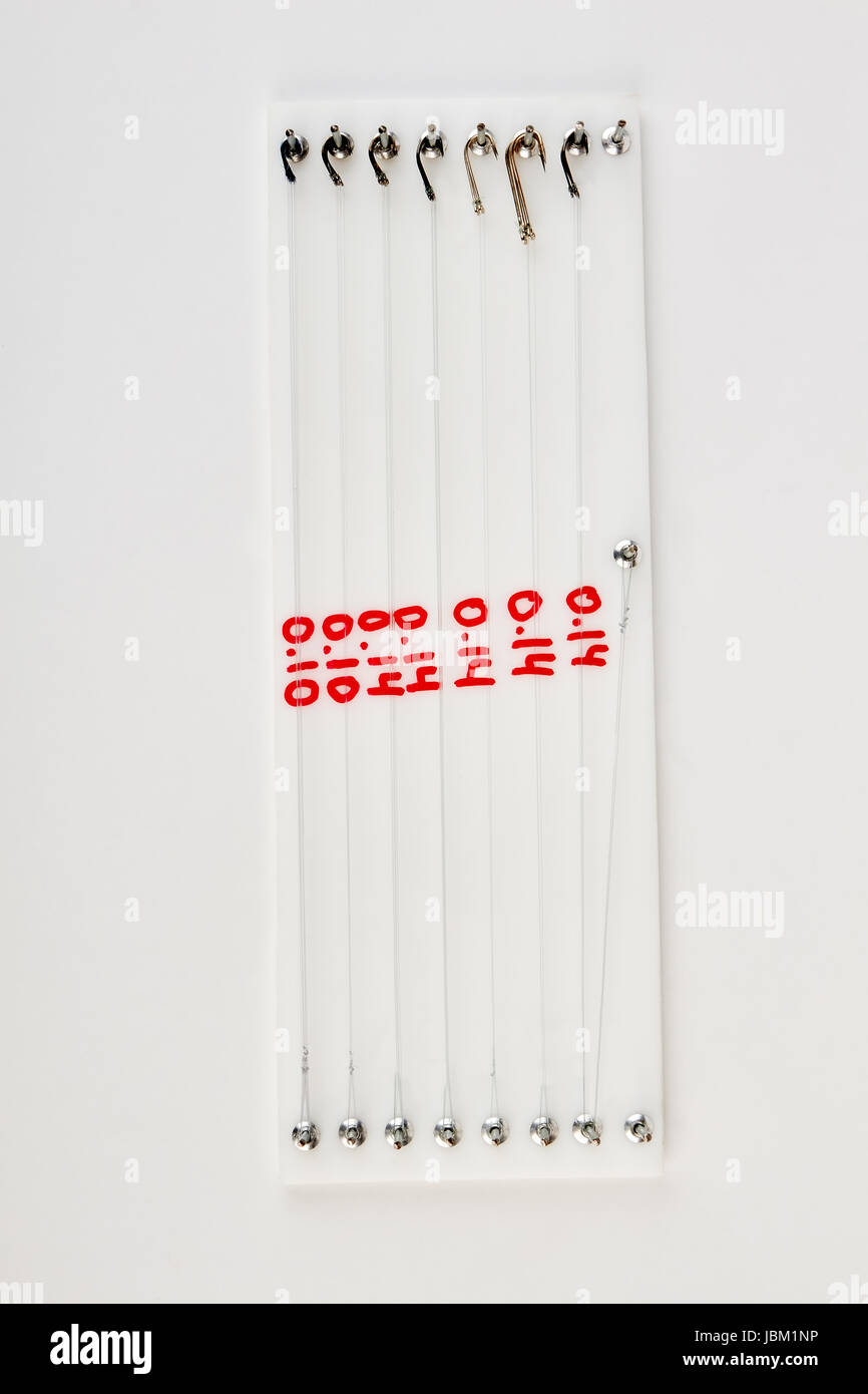 Fishing hooks on white background Stock Photo - Alamy