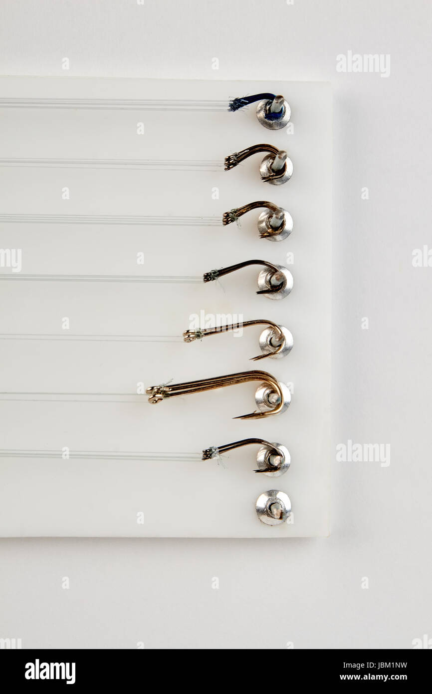 Vertical image of metallic hooks Stock Photo - Alamy