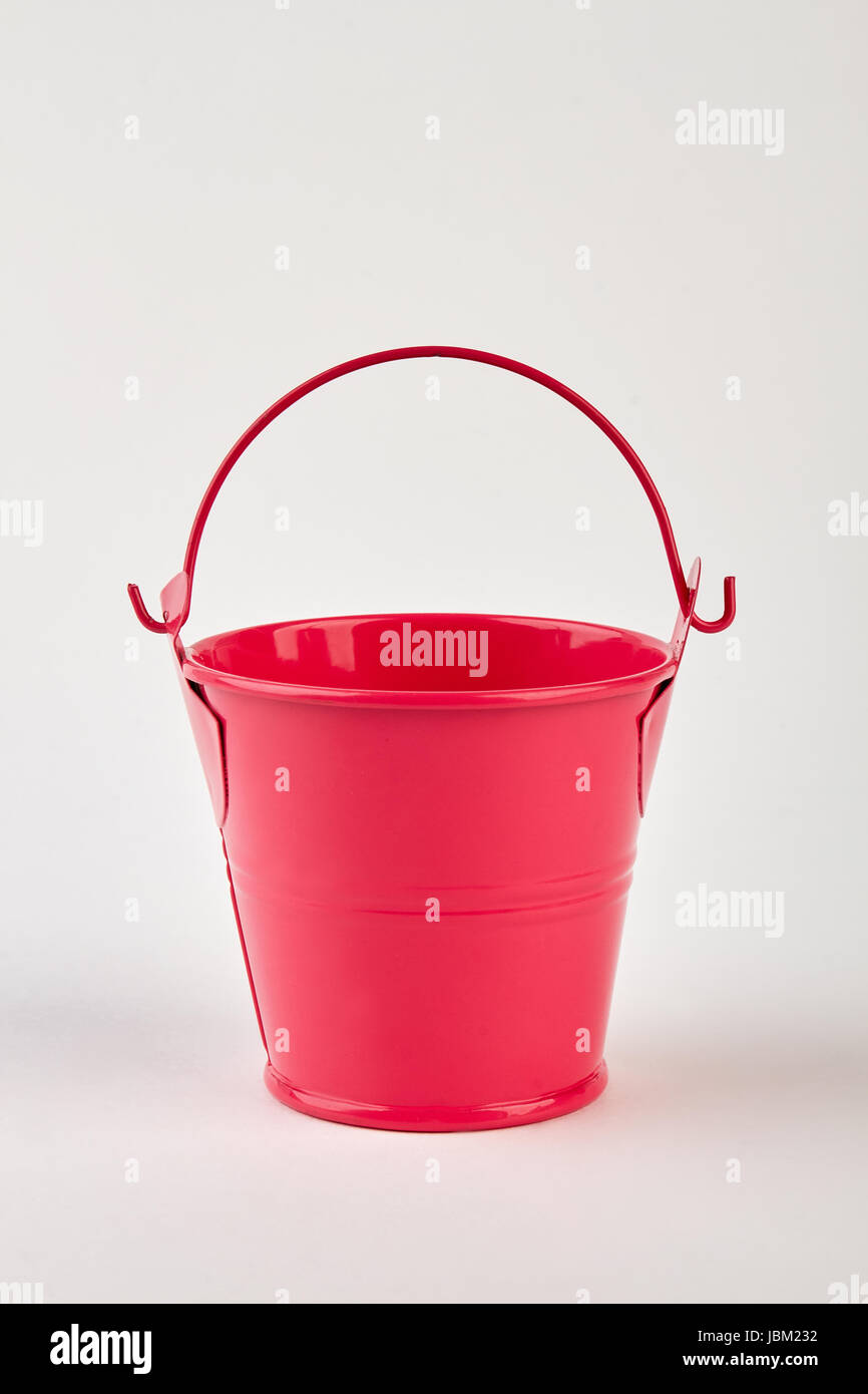 Red bucket on white background Stock Photo - Alamy