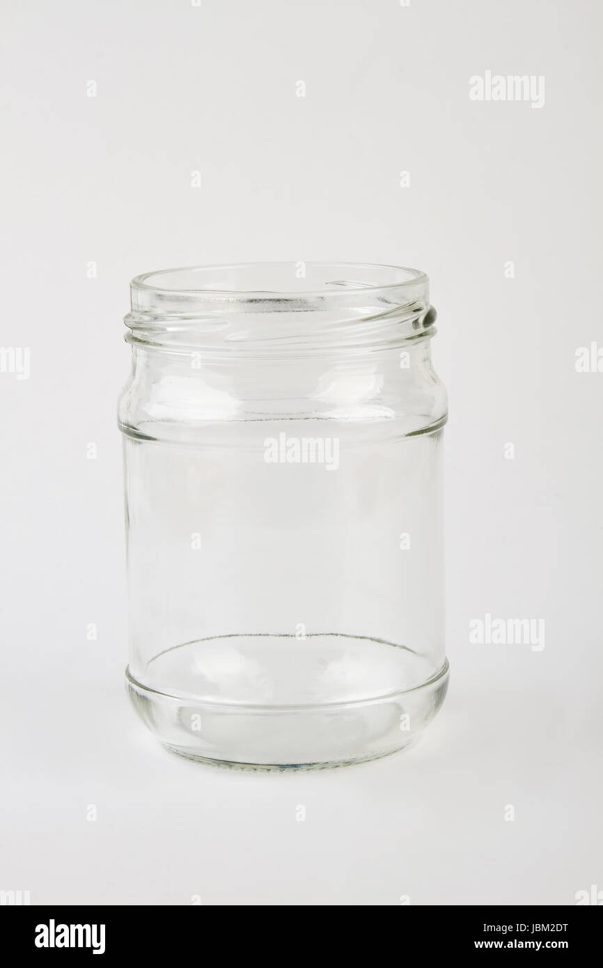 Opened glass jar, white background Stock Photo - Alamy