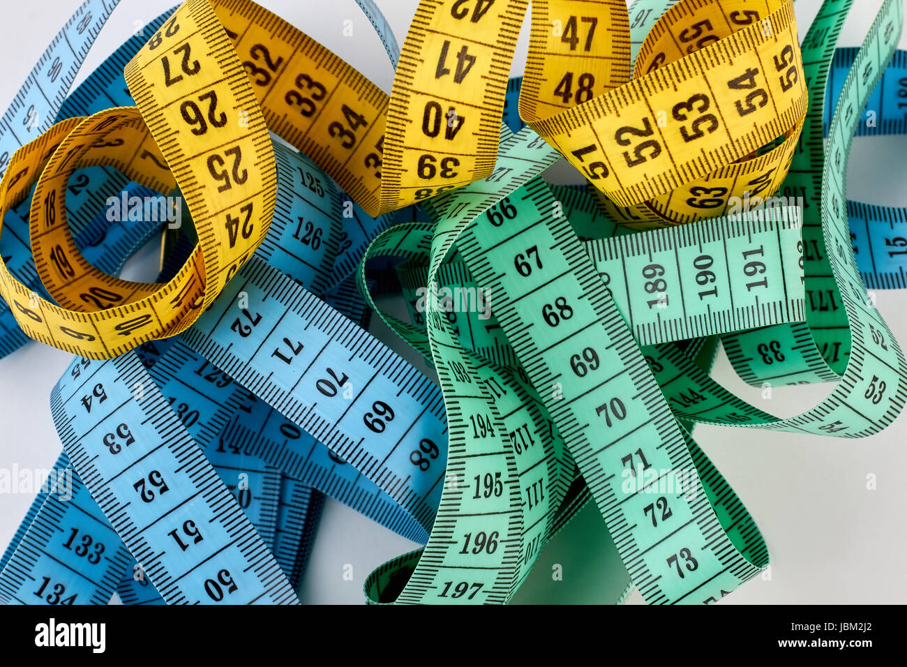 Heap of measuring tapes Stock Photo - Alamy