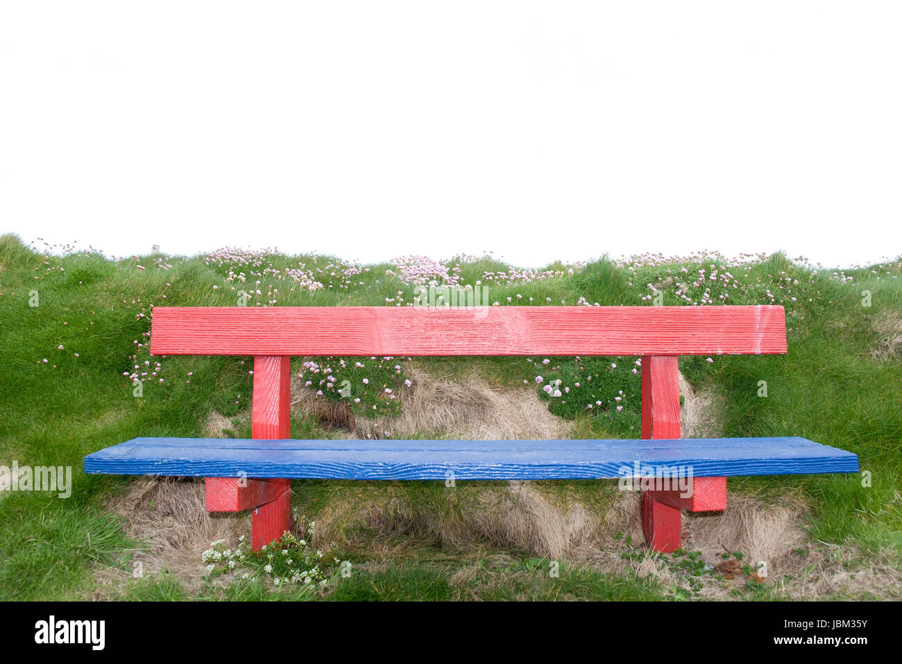 red and blue bench positioned at the edge on top of a cliff Stock Photo ...
