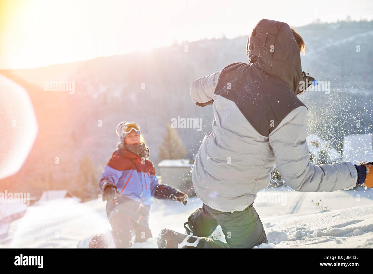 Couple enjoying snowball fight in hi-res stock photography and images ...