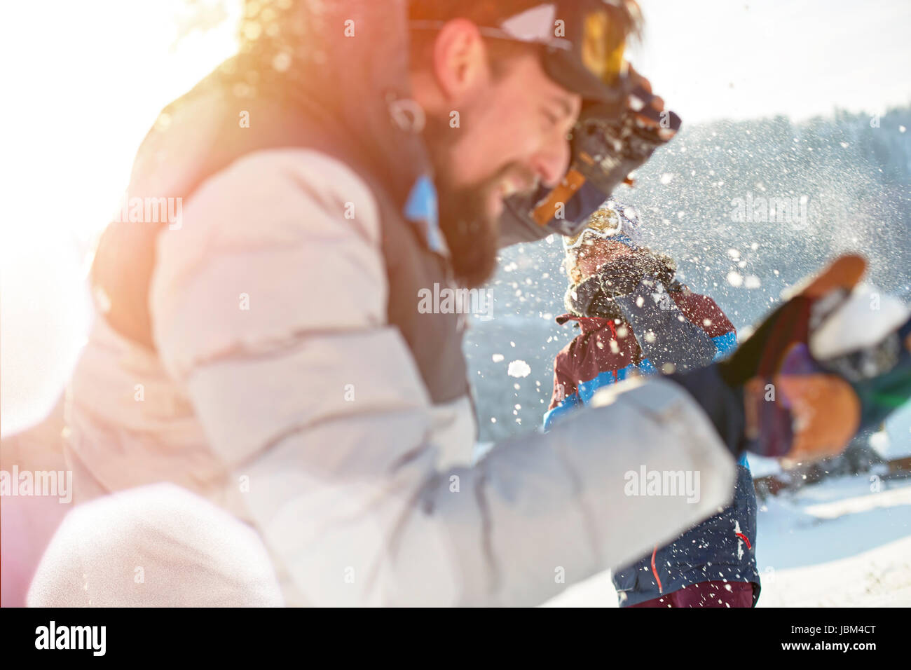 Couple enjoying snowball fight in hi-res stock photography and images ...