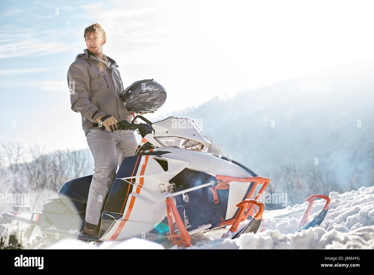 Man driving snowmobile hi-res stock photography and images - Alamy