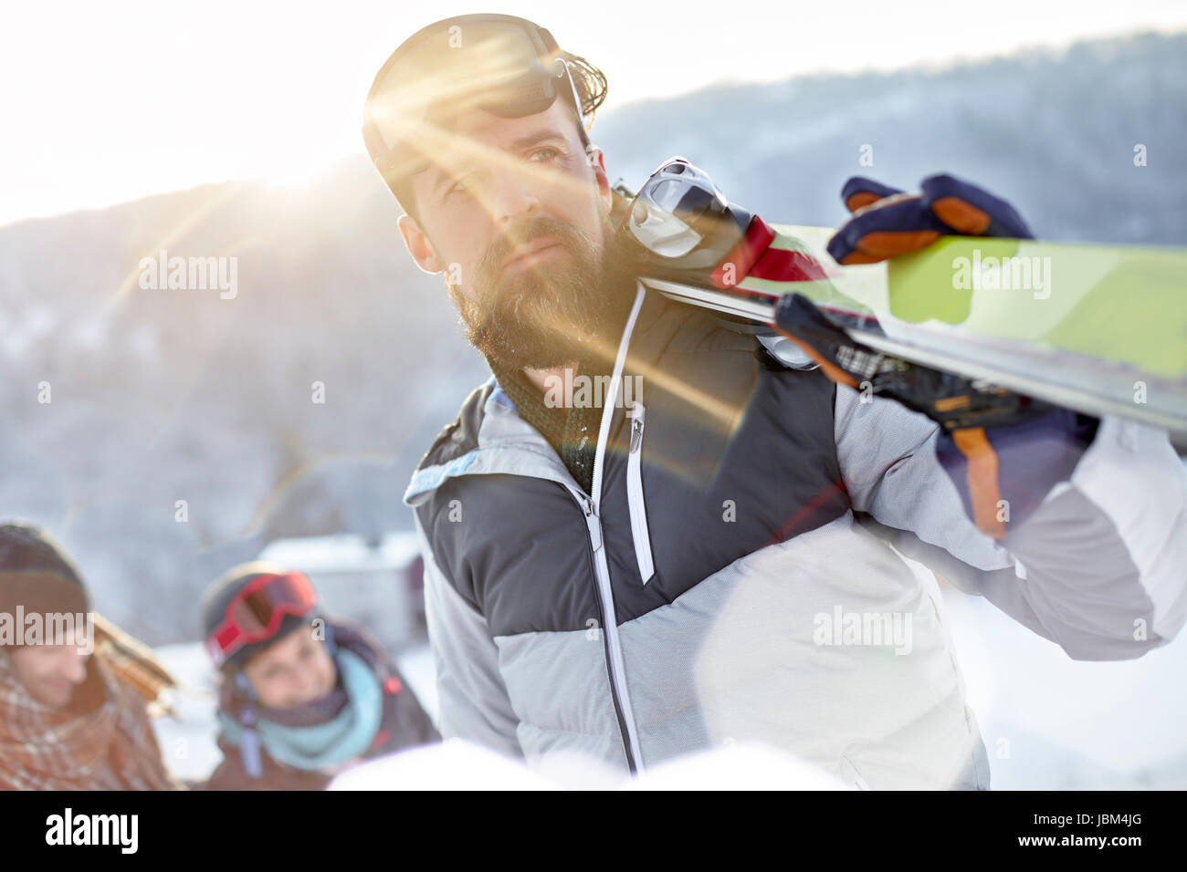 Male skier carrying skis hi-res stock photography and images - Alamy