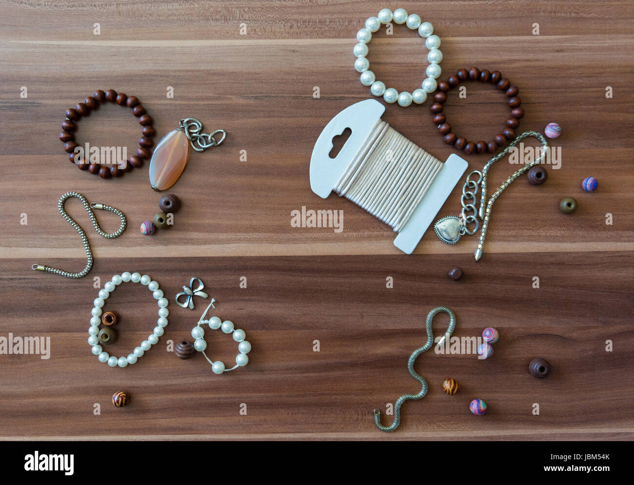 Beads, pearls, thread and string for handcrafting Stock Photo - Alamy