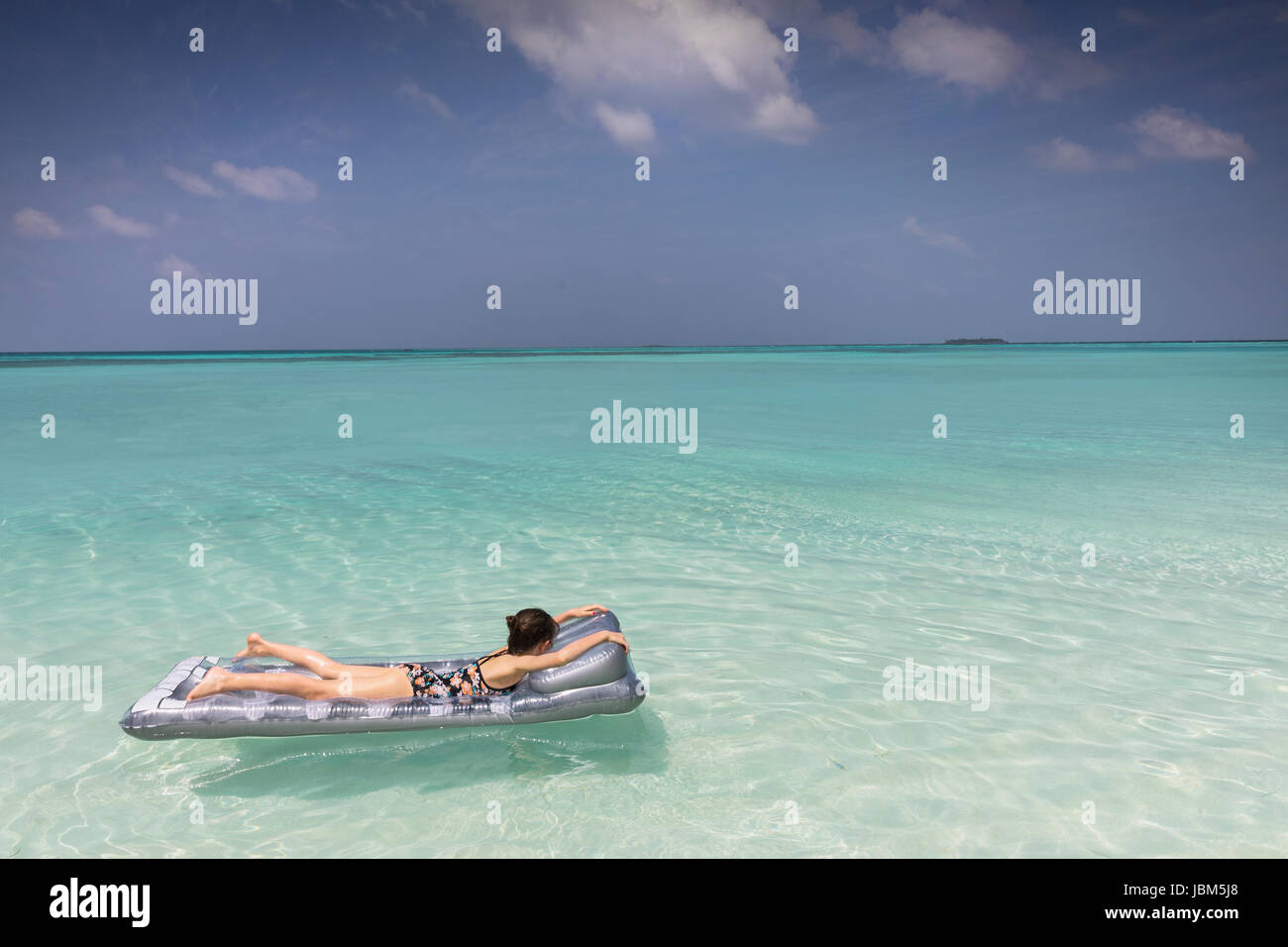 Girl floating in inflatable raft hi-res stock photography and images ...