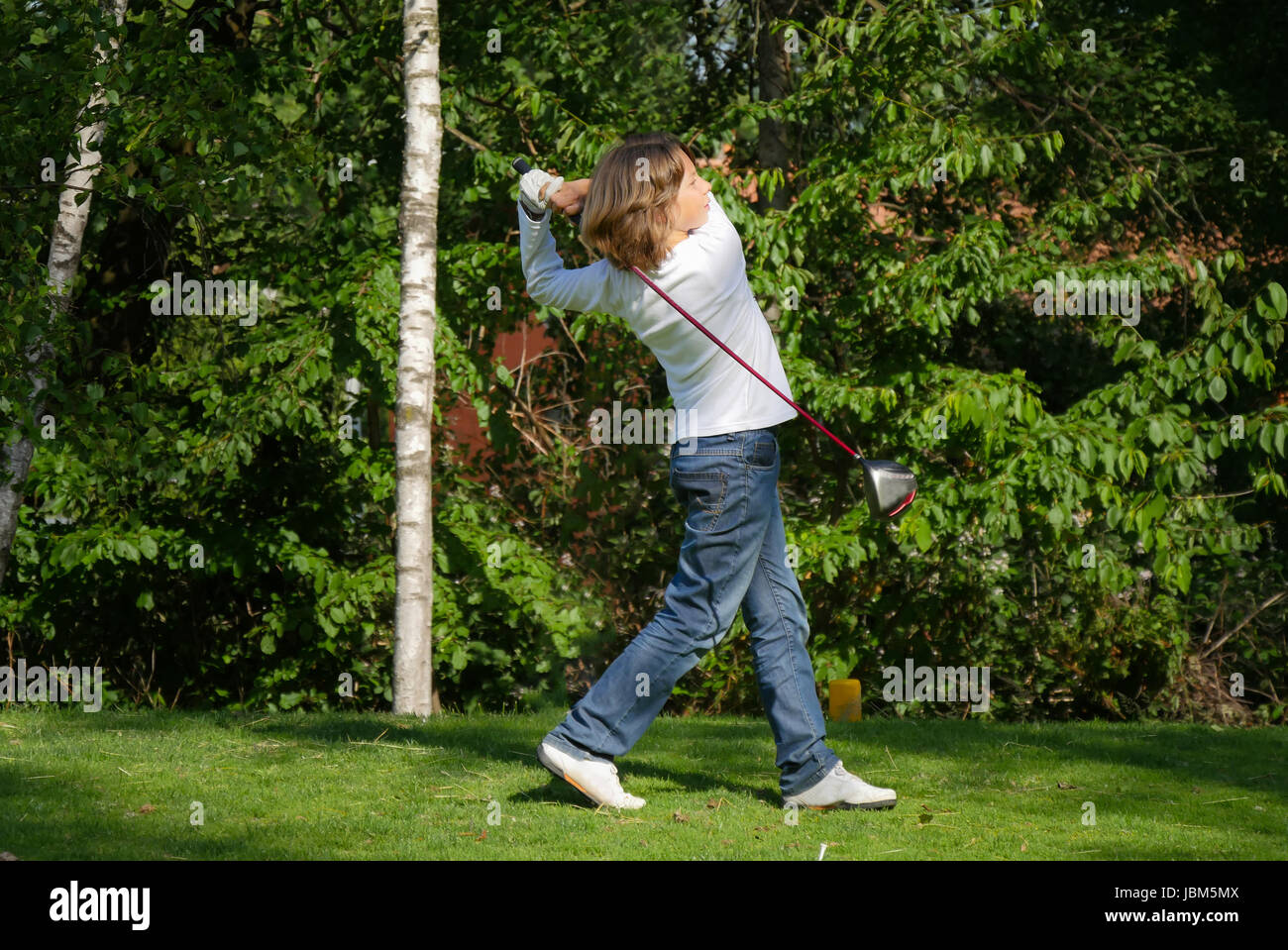Boy swinging driver hi-res stock photography and images - Alamy