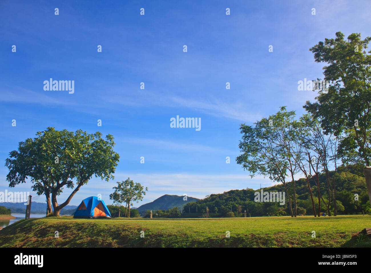 Camping in the wilderness, tent on campground in morning Stock Photo ...