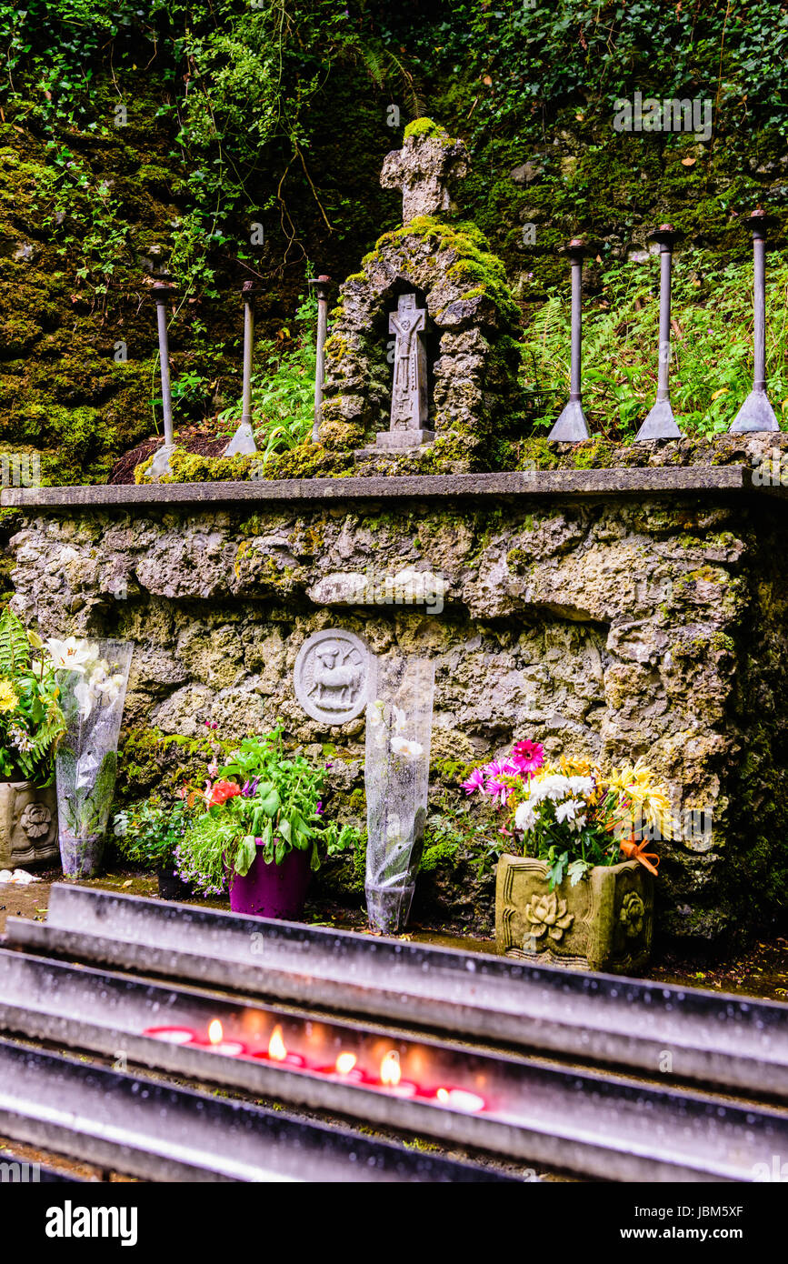 Altar with candles and crosses at the Tobarnalt Holy Well, County Sligo ...