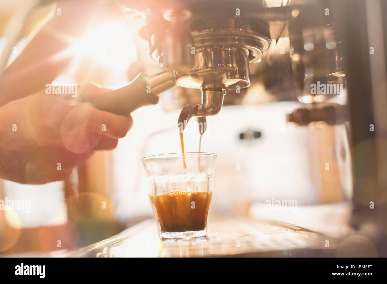 Close up hand of barista using espresso machine in cafe Stock Photo - Alamy