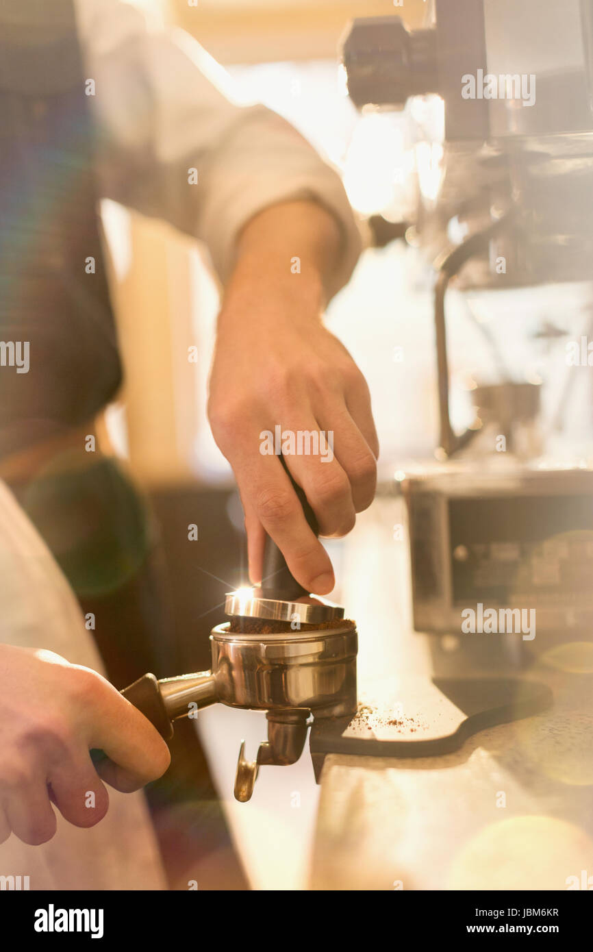Close up barista pressing espresso, using espresso machine Stock Photo ...