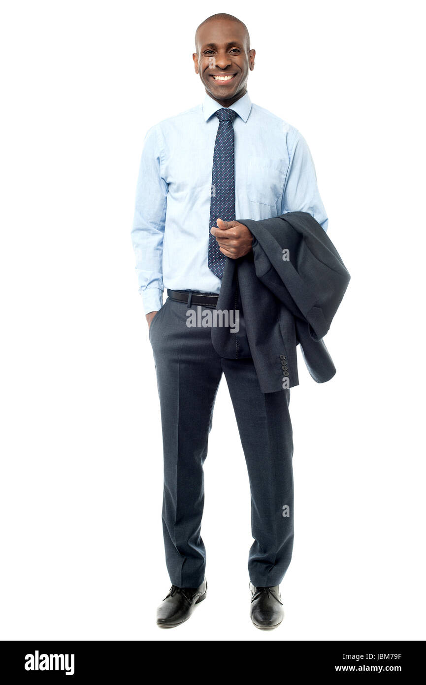 Relaxed businessman holding coat on his hand Stock Photo - Alamy