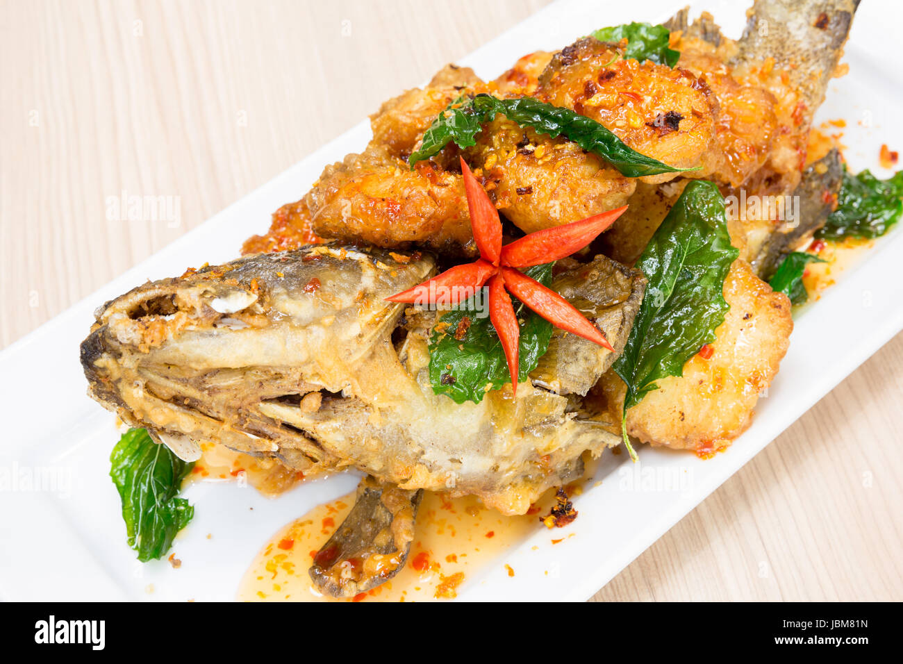 deep fried sweet and sour spicy sauce grouper fish Stock Photo - Alamy