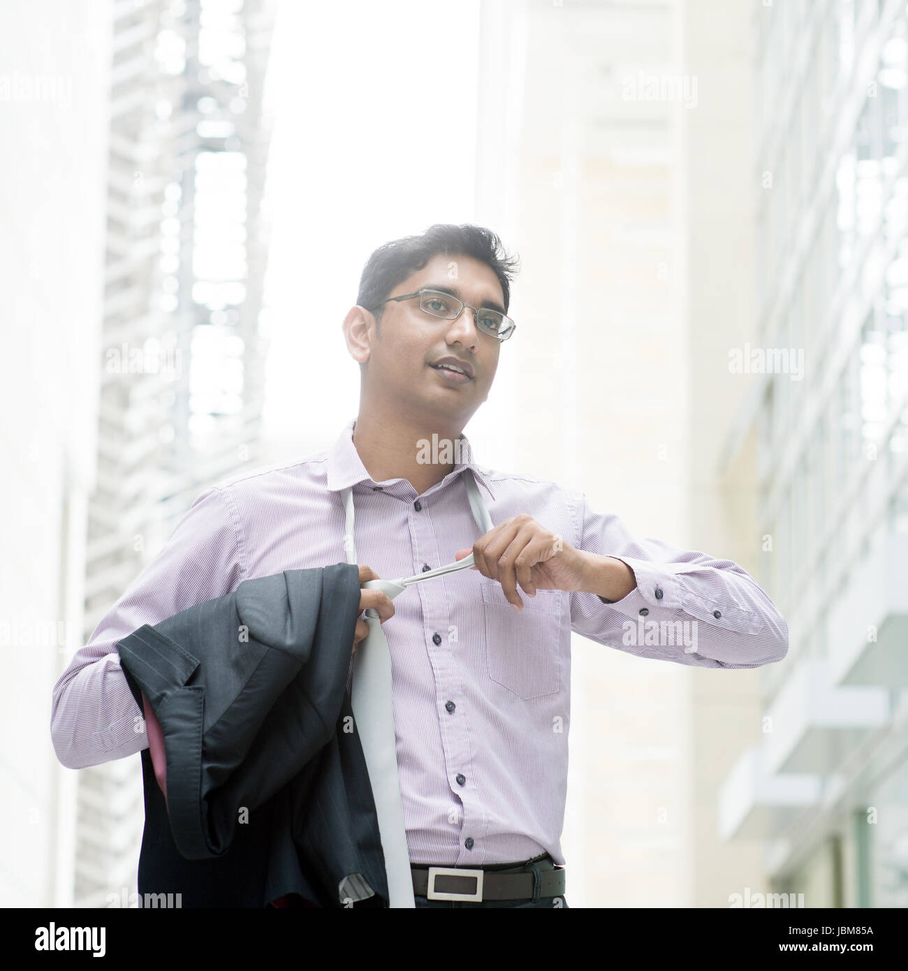 Taking off his tie hi-res stock photography and images - Alamy