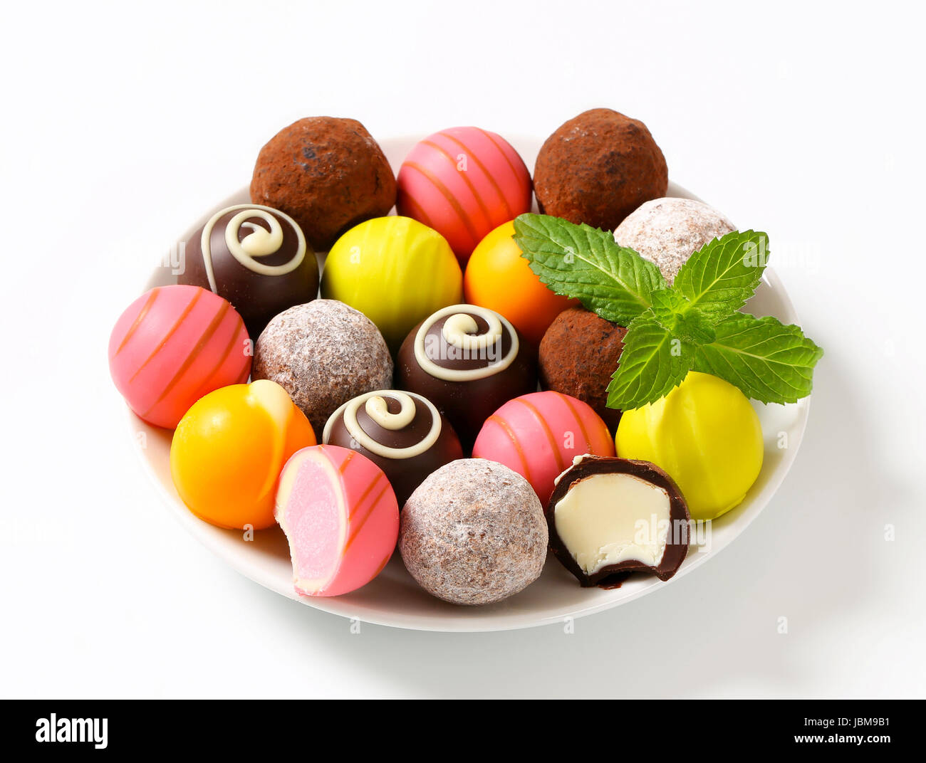 Assorted chocolate truffles and fruit ganache pralines Stock Photo - Alamy