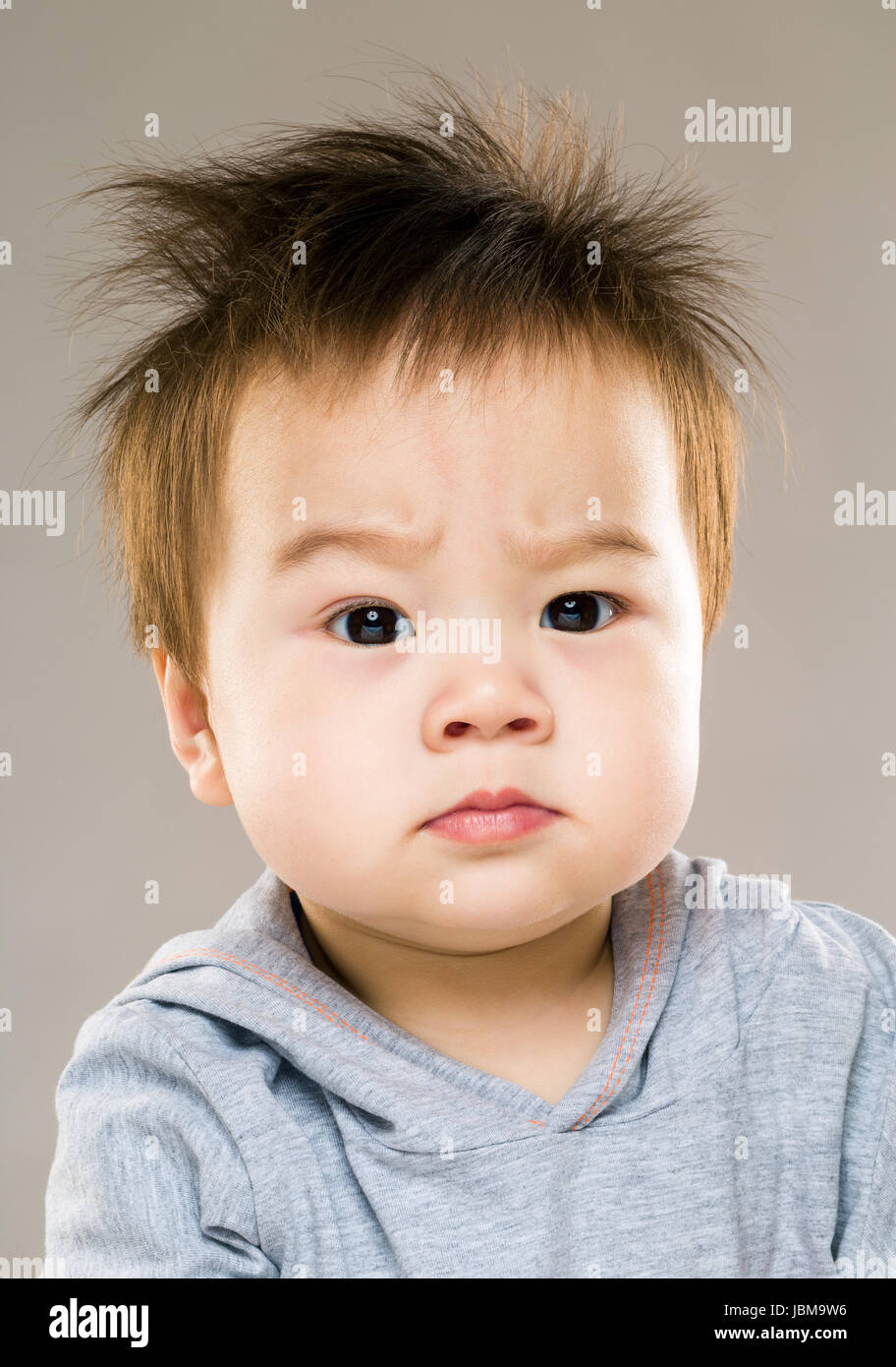 Baby boy eyebrow frown Stock Photo - Alamy
