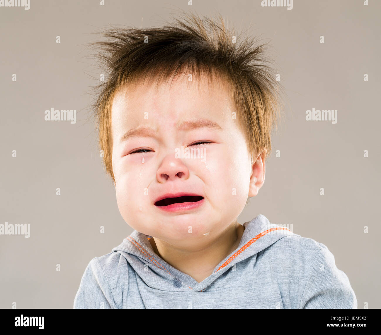 Crying asian baby boy Stock Photo - Alamy