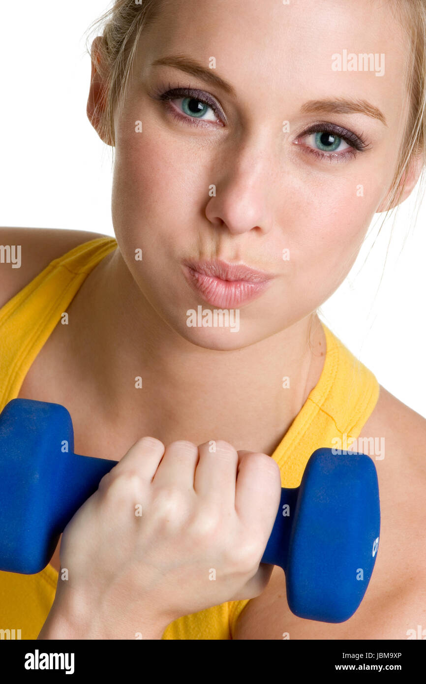 Pretty fitness girl lifting weights Stock Photo - Alamy