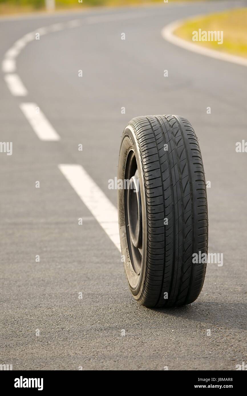 Wheel of a car on a road Stock Photo - Alamy