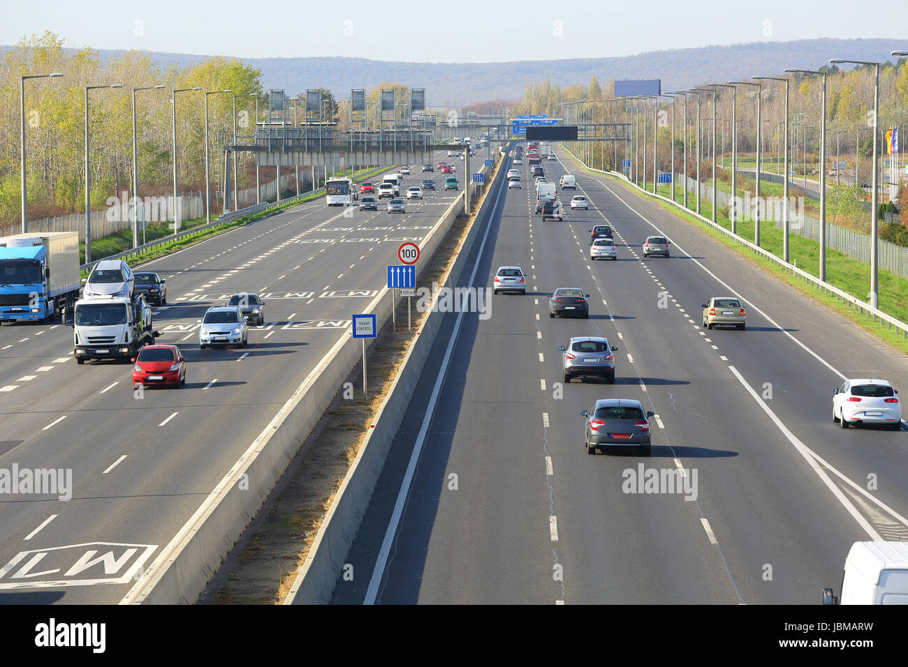 Highway with cars passing by Stock Photo - Alamy