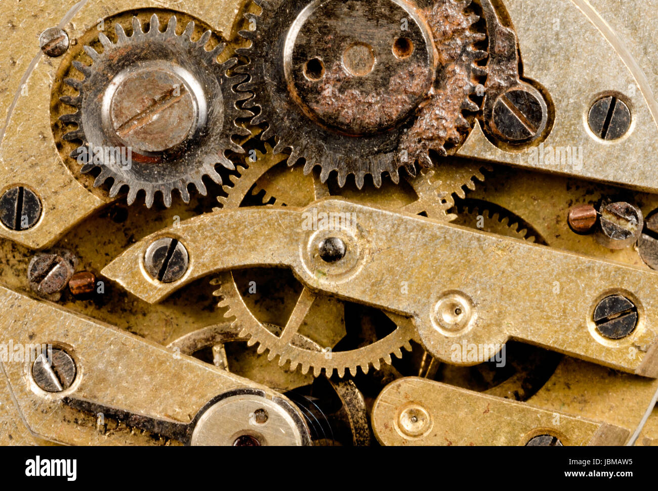 Extreme close up of the inside workings of a jeweled pocket watch time ...