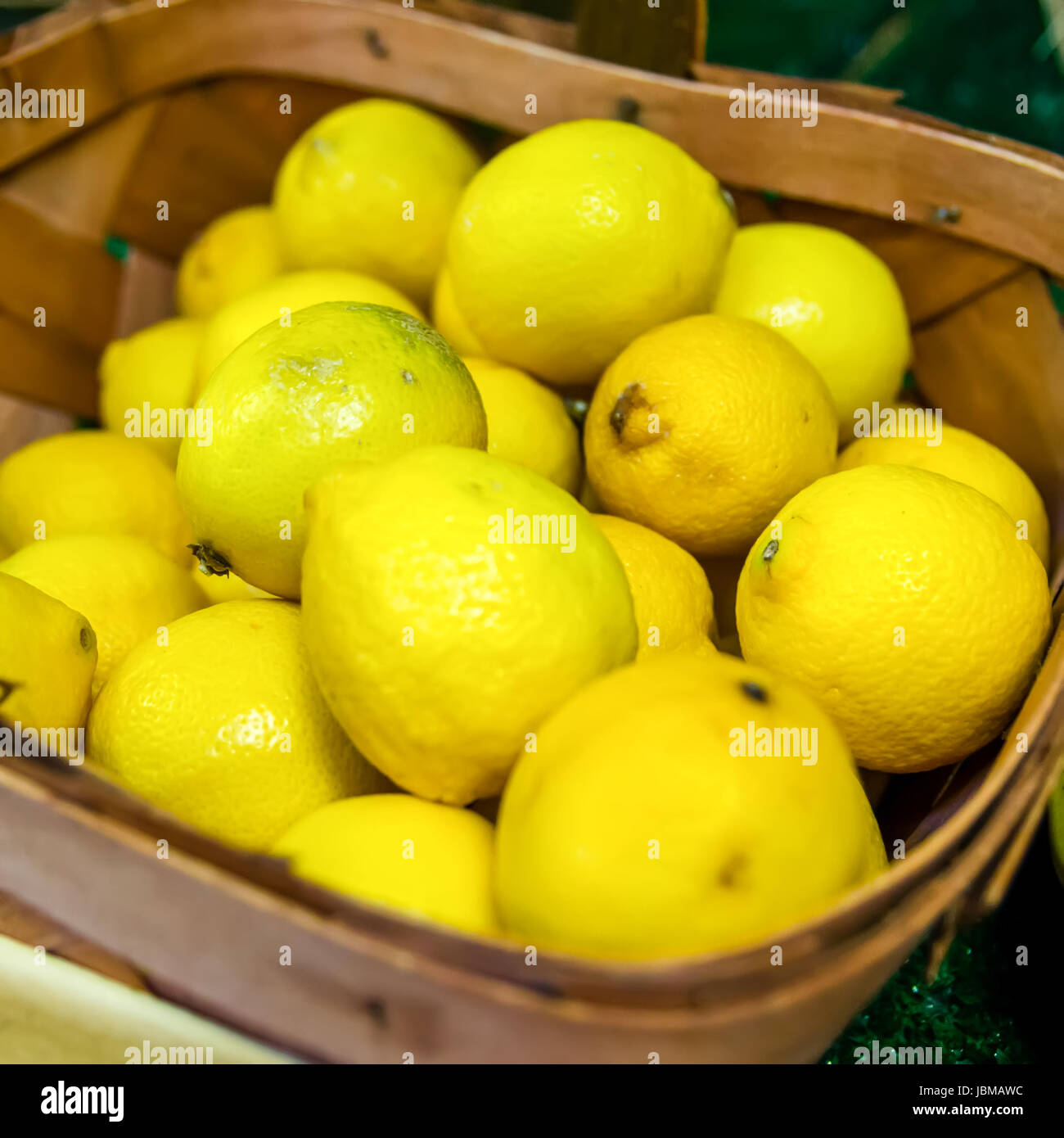 Colorful Display Of Lemons In Market in a basket Stock Photo - Alamy