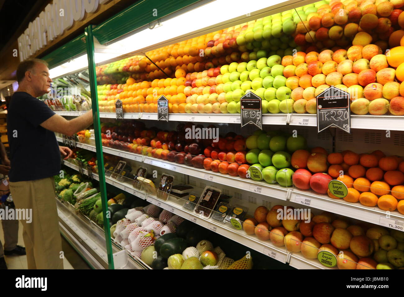 A customer buying organic vegetable and fruit in shopping mall Stock ...