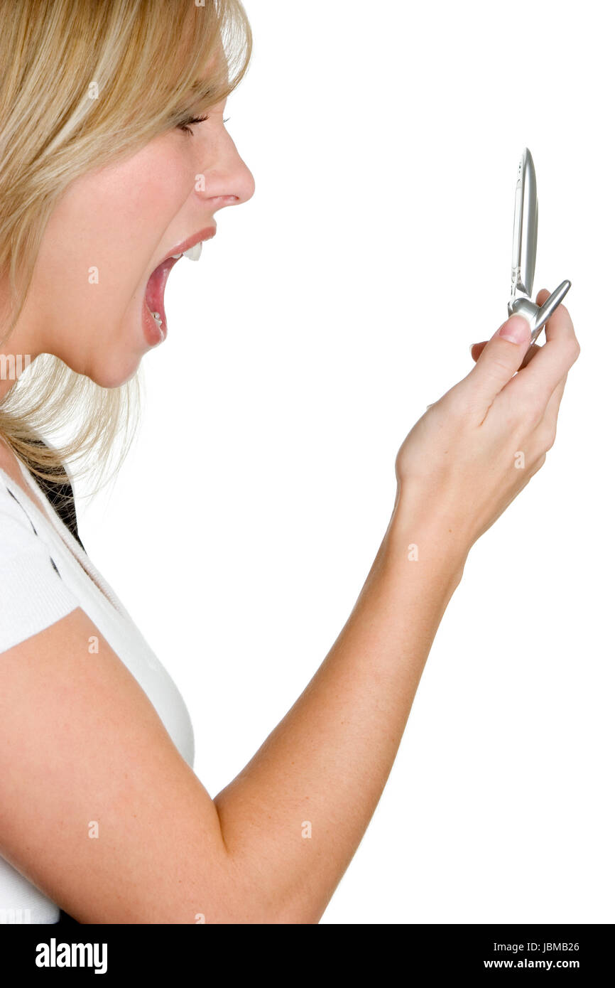 Young woman yelling into phone Stock Photo - Alamy