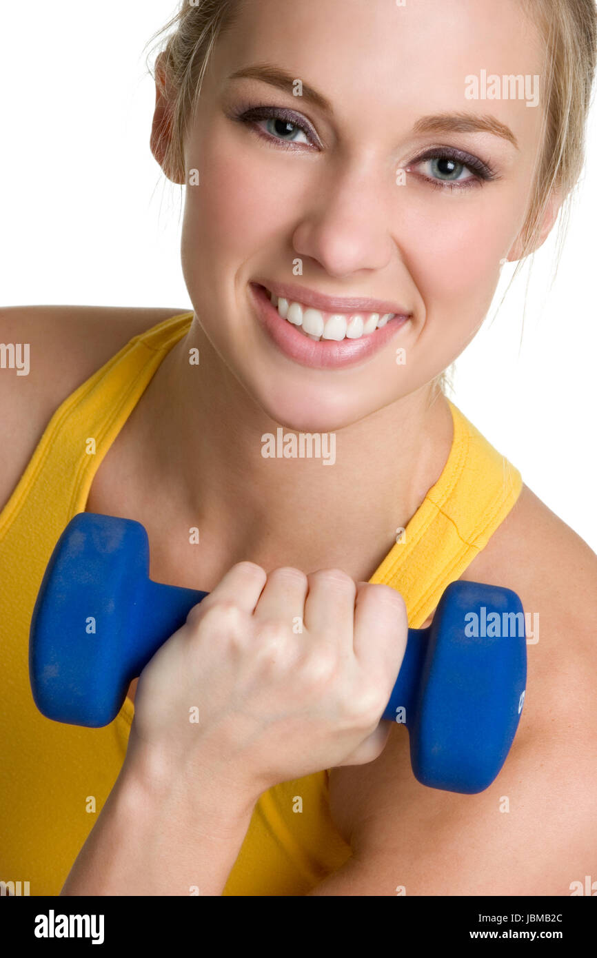 Beautiful smiling woman lifting weights Stock Photo - Alamy
