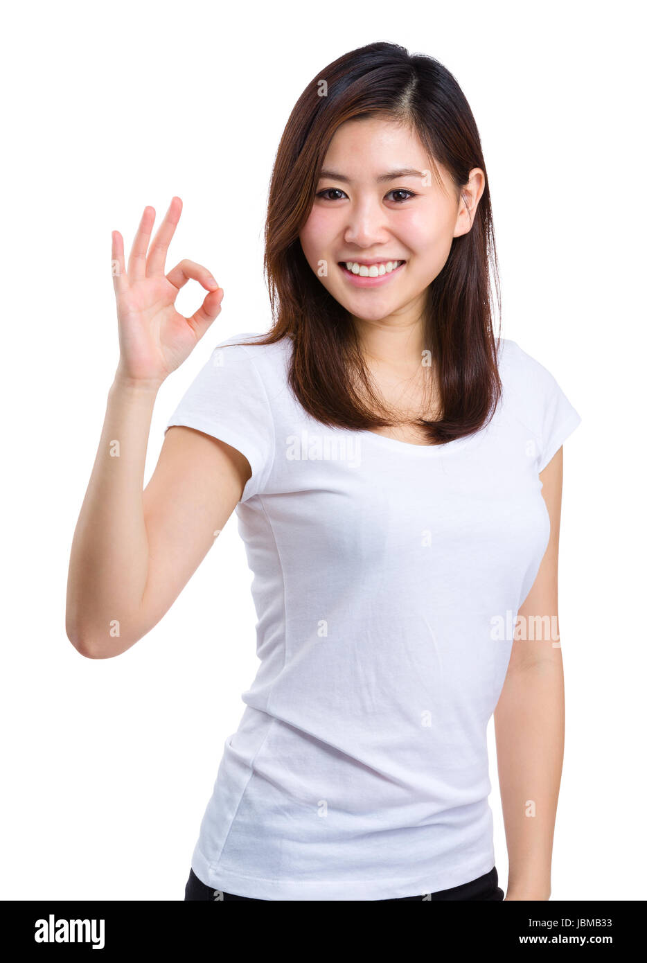 Beautiful young woman showing ok sign Stock Photo - Alamy