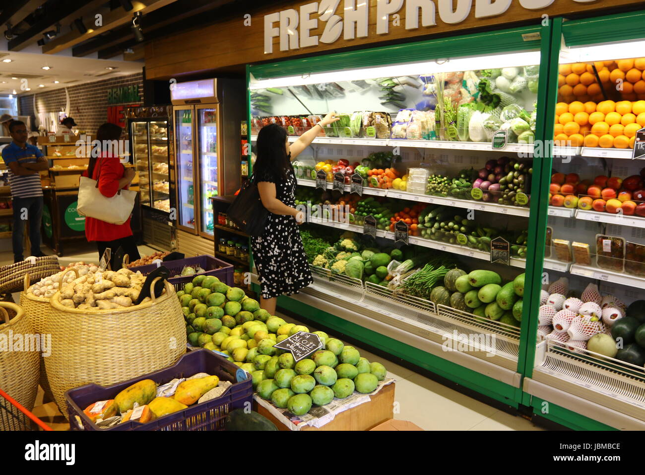 A customer buying organic vegetable and fruit in shopping mall in Dhaka ...