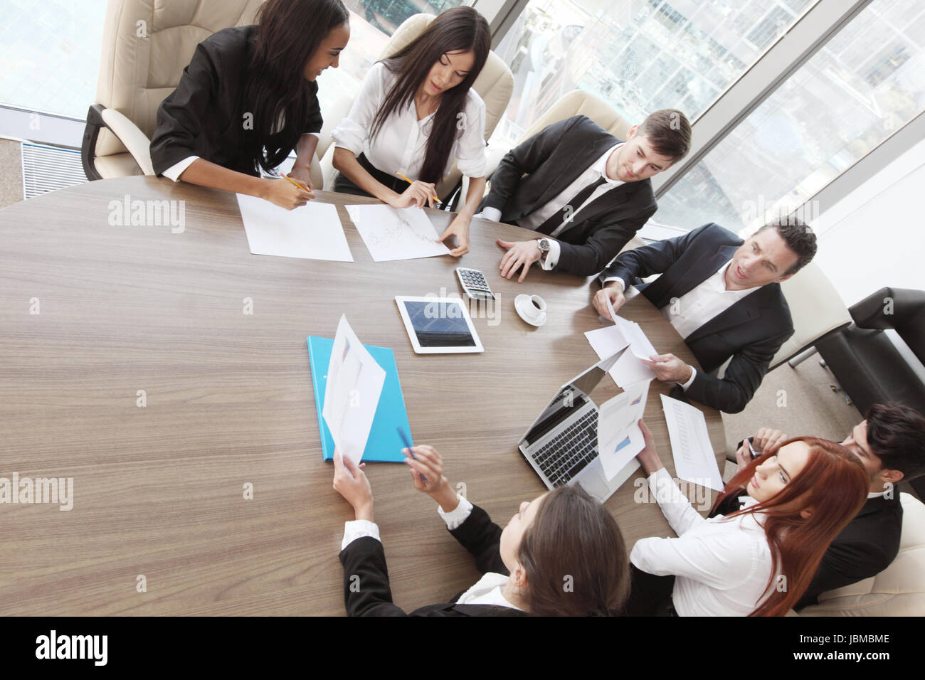 Business meeting of diverse people around the table Stock Photo - Alamy